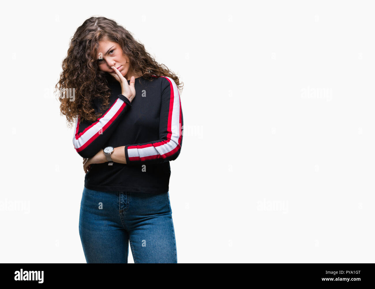 Beautiful young brunette curly hair girl wearing casual look over ...