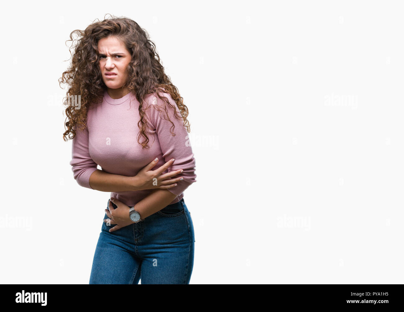 Beautiful brunette curly hair young girl wearing pink sweater over ...
