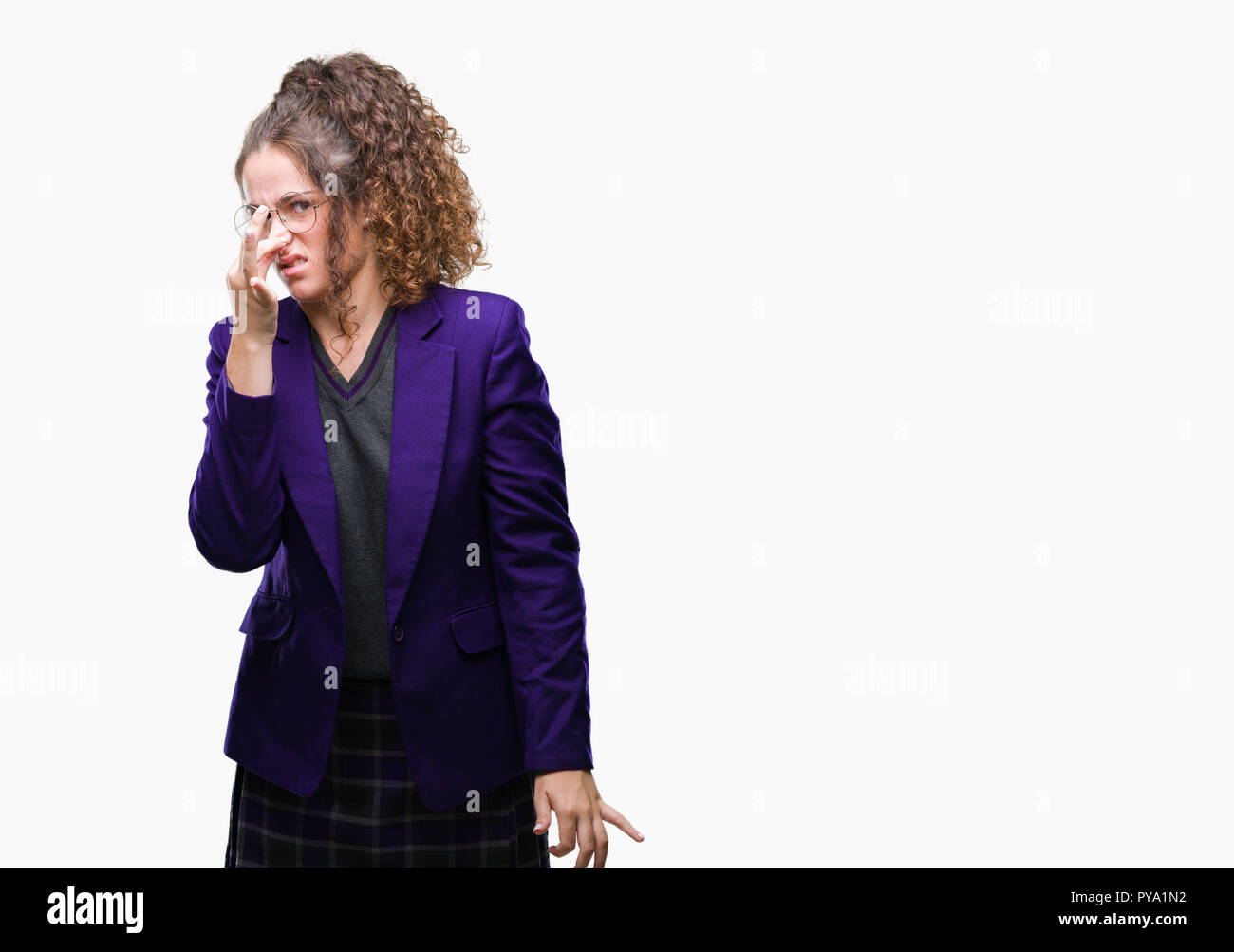 Young brunette student girl wearing school uniform and glasses over ...