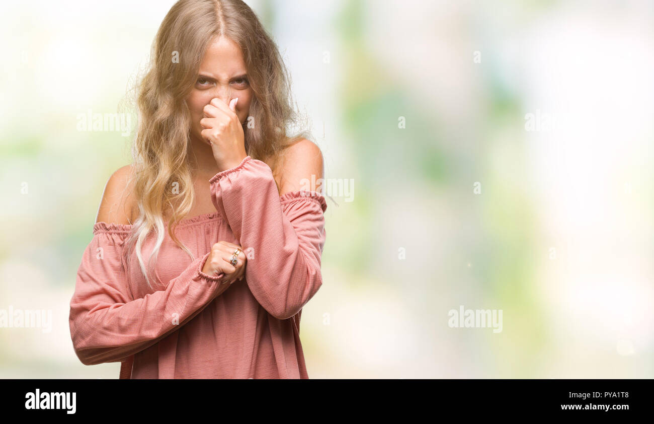 Beautiful Young Blonde Woman Over Isolated Background Smelling