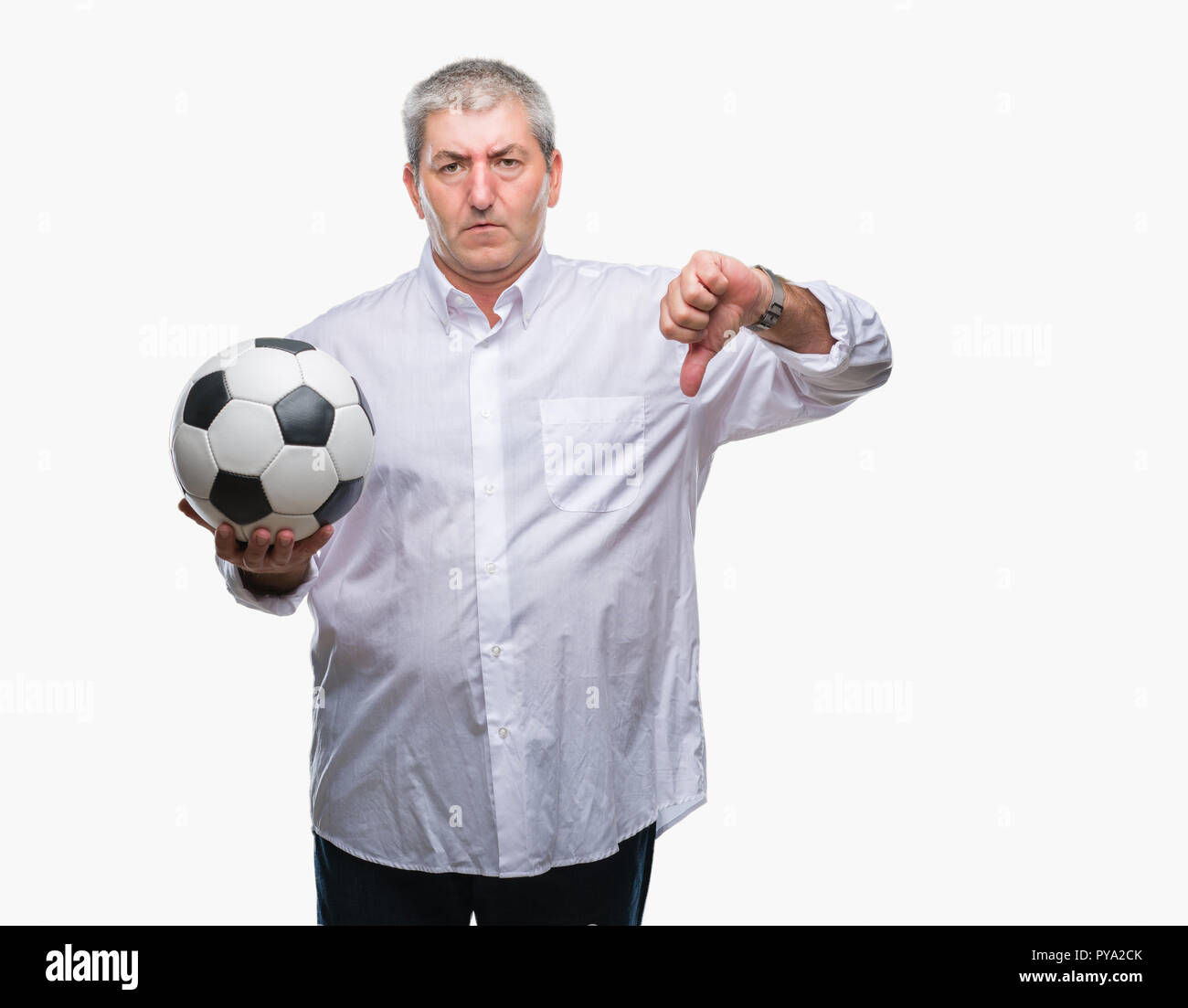 Handsome senior man holding soccer football ball over isolated ...