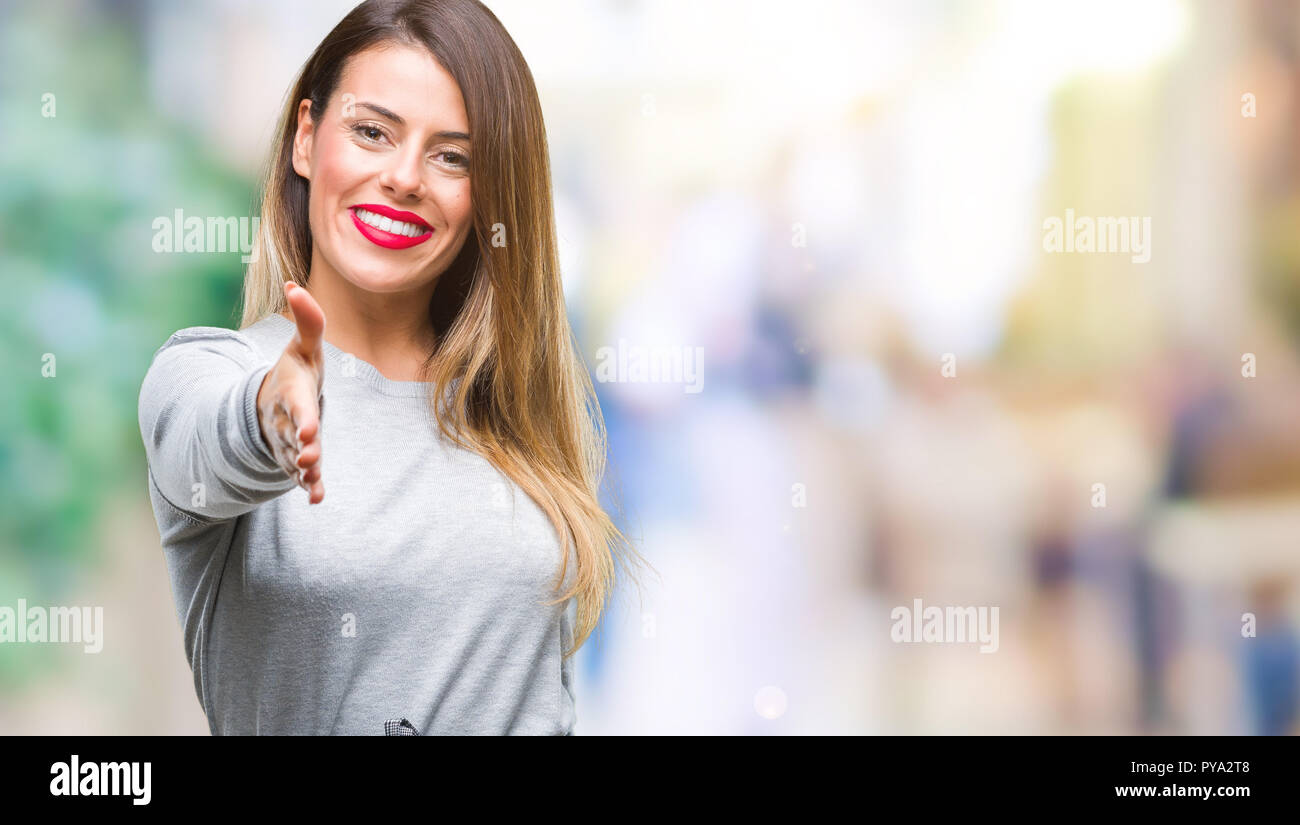 Young beautiful worker business woman over isolated background smiling ...