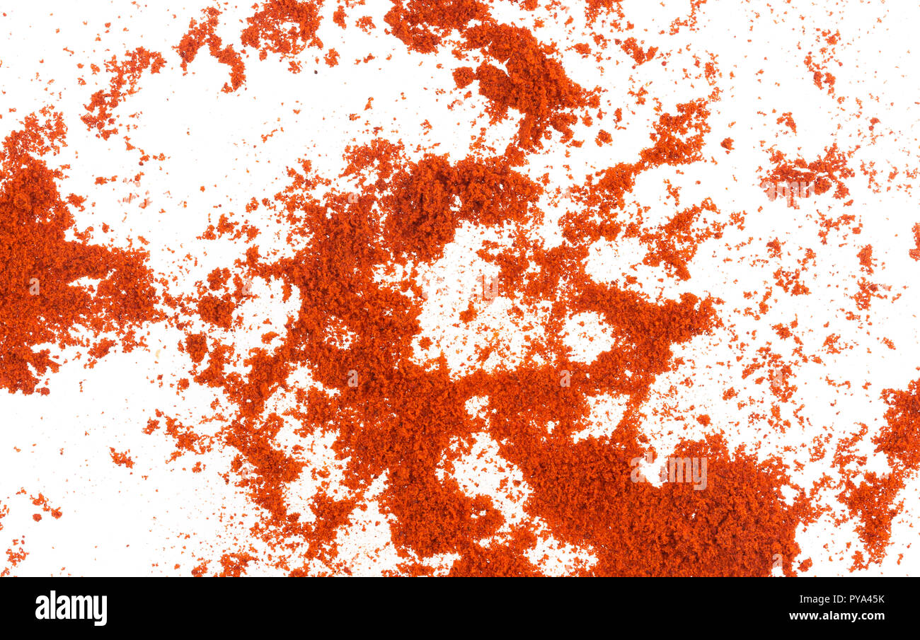 Scattered red paprika powder isolated on white background. Top view ...