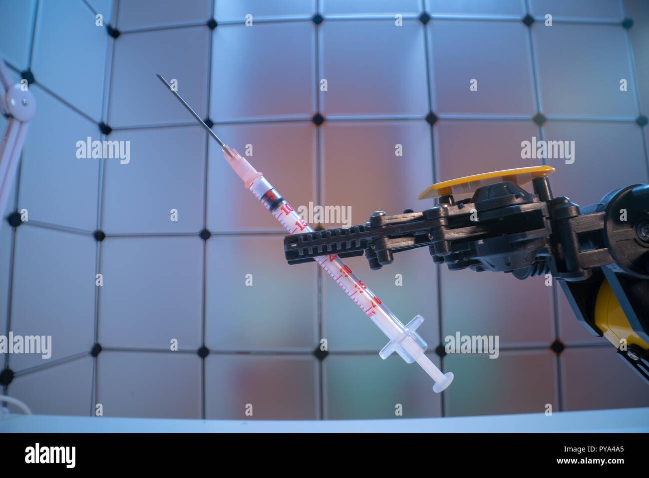 Medical syringe in the robot arm, Model of industrial robot manipulator ...