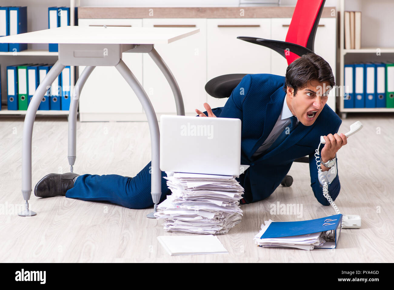Tired exhausted businessman working overtime in office Stock Photo - Alamy