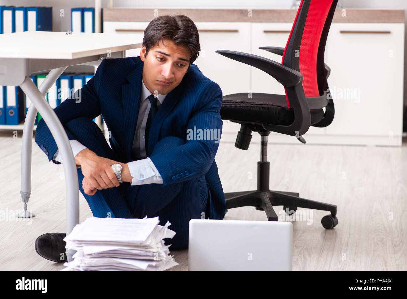 Tired exhausted businessman working overtime in office Stock Photo - Alamy