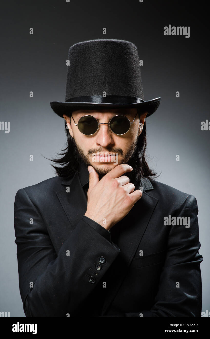 Vintage concept with man wearing black top hat Stock Photo - Alamy
