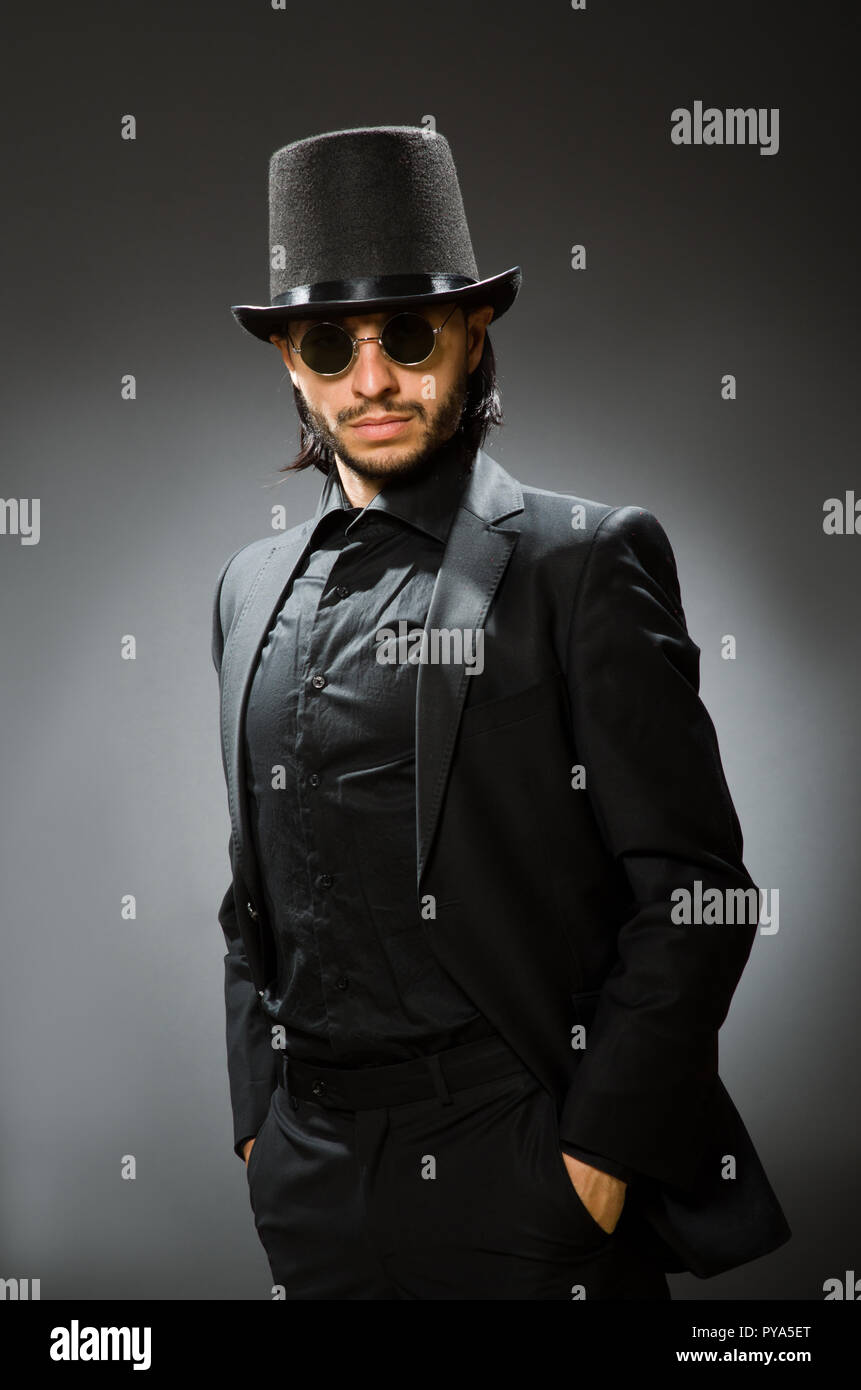 Vintage concept with man wearing black top hat Stock Photo - Alamy