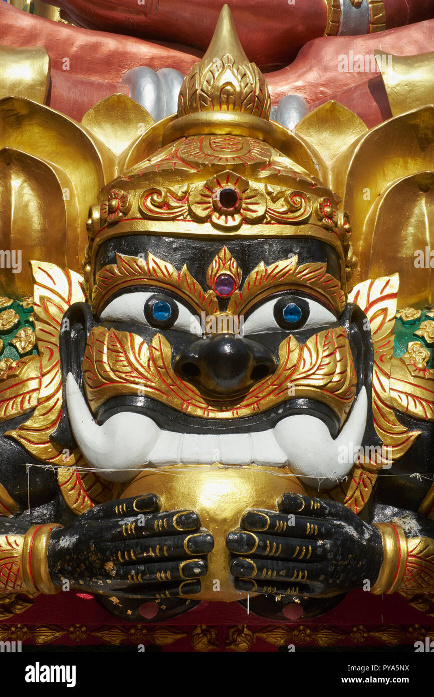 A depiction of demon Rahu, the God of Darkness, eating the sun; Wat ...