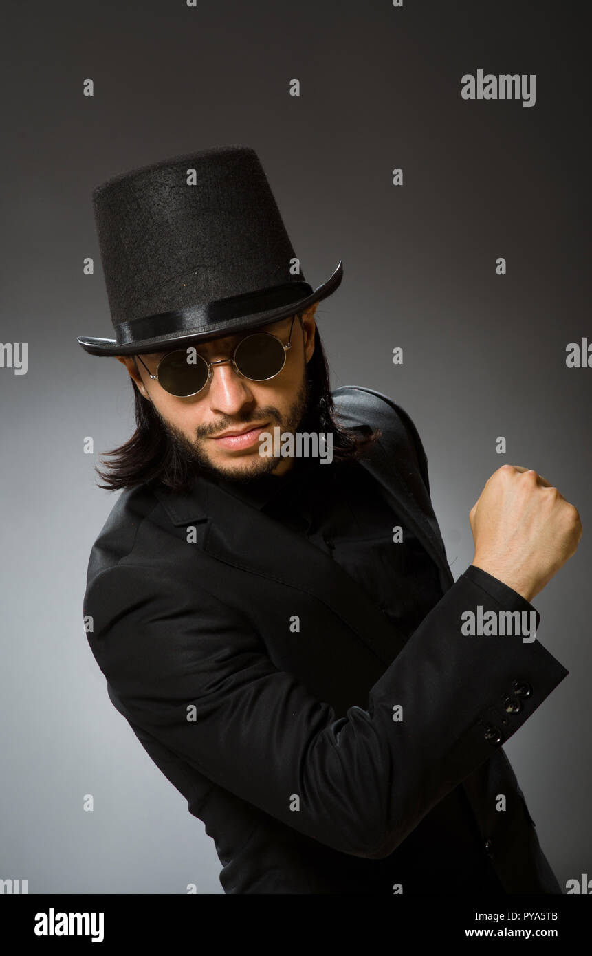 Vintage concept with man wearing black top hat Stock Photo - Alamy