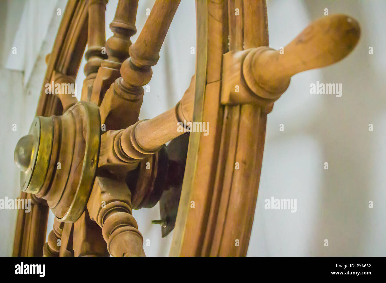 Vintage old wooden ship steering wheel in the public naval museum ...