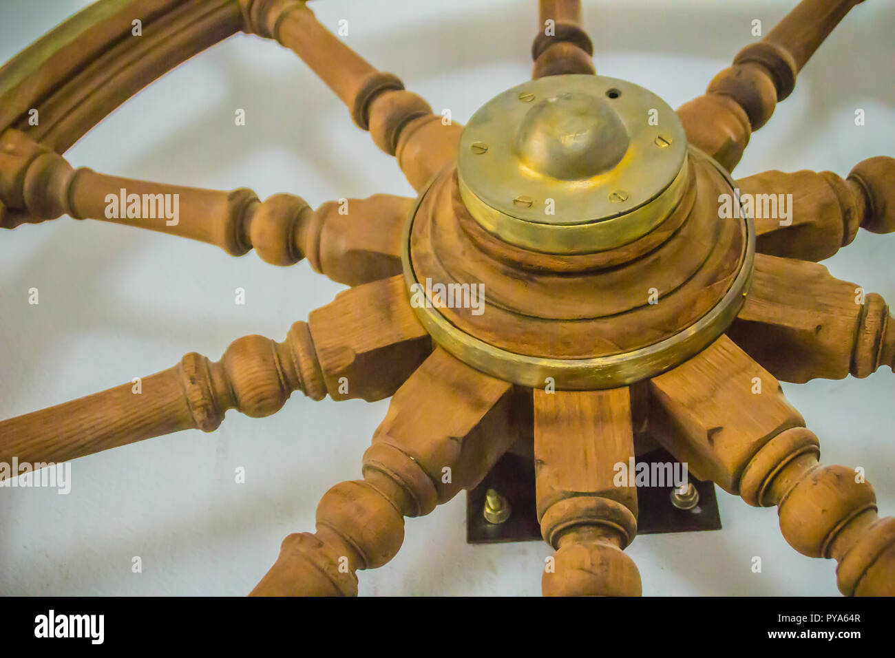 Vintage old wooden ship steering wheel in the public naval museum ...