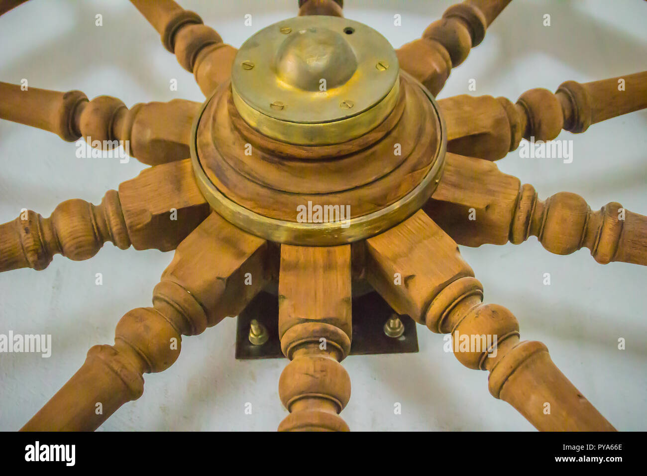 Vintage old wooden ship steering wheel in the public naval museum ...