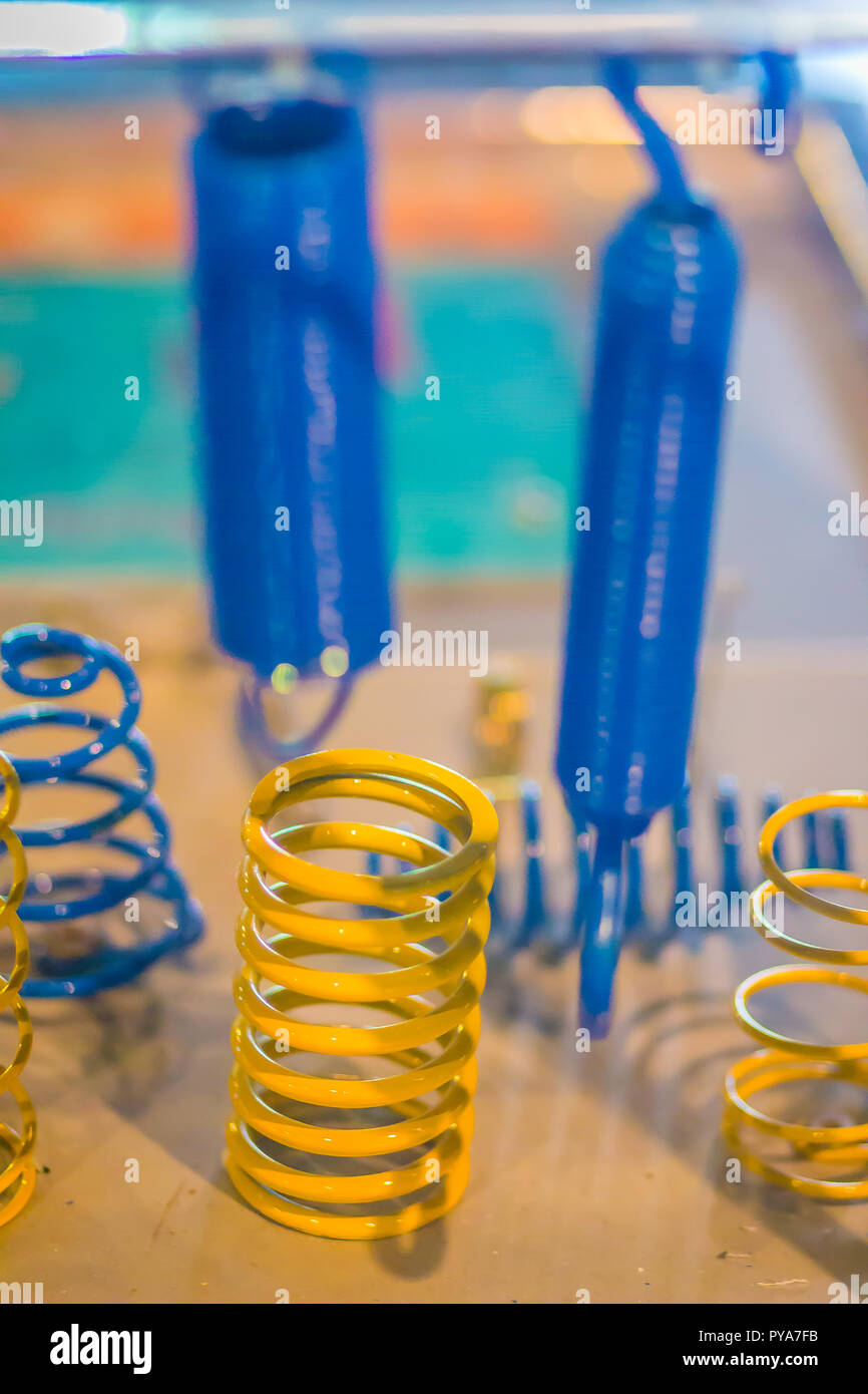 Sample product of blue and yellow metal helical coil springs Stock ...