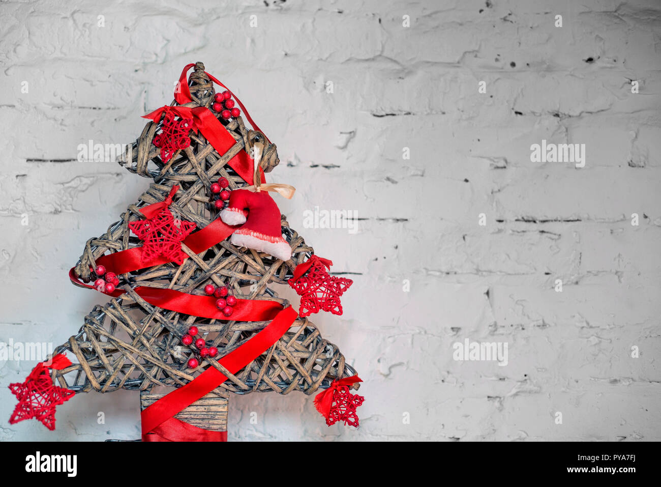 Christmas decoration of fir tree made of straw Stock Photo - Alamy