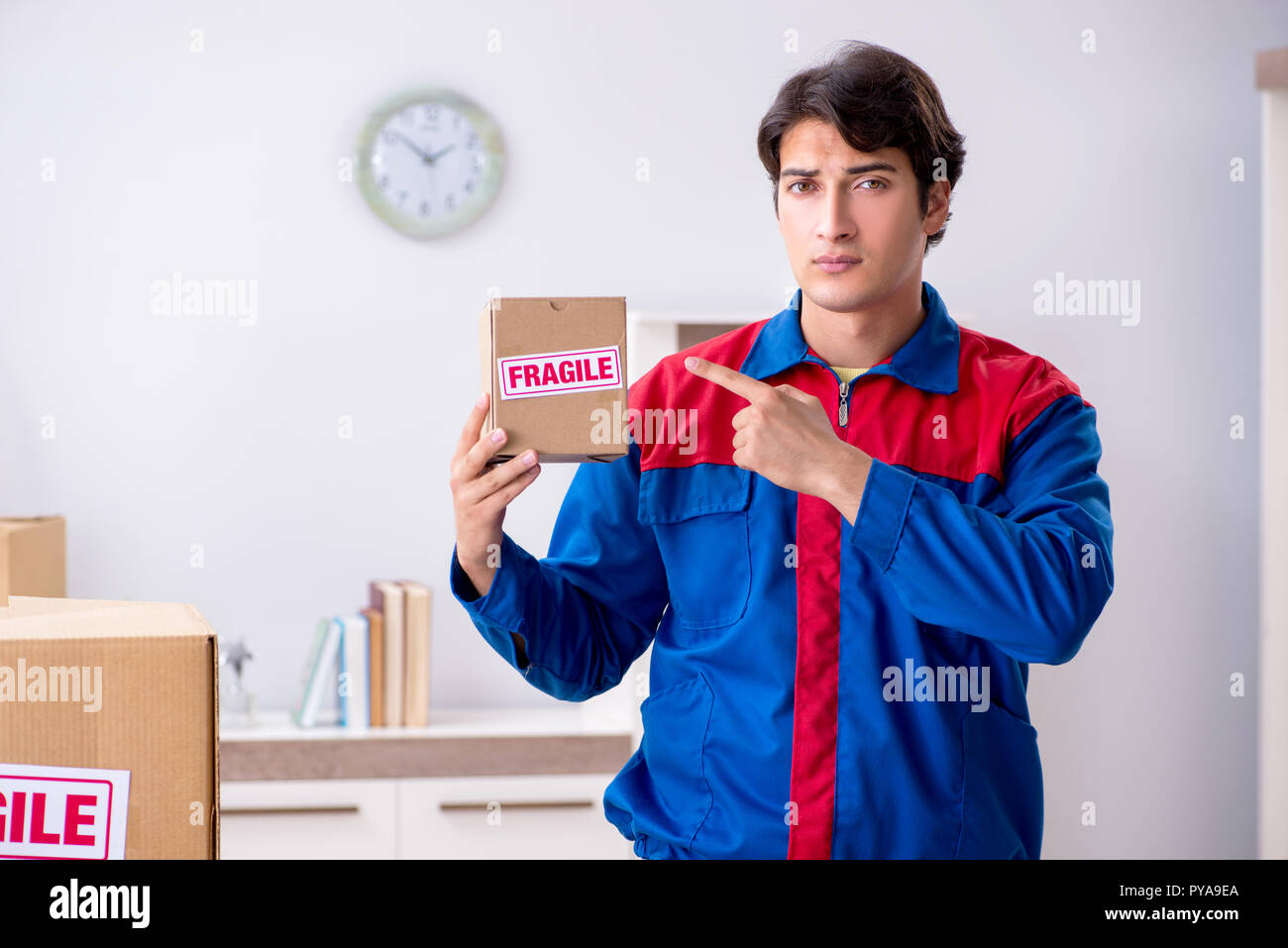 Transportation contractor with fragile boxes Stock Photo - Alamy