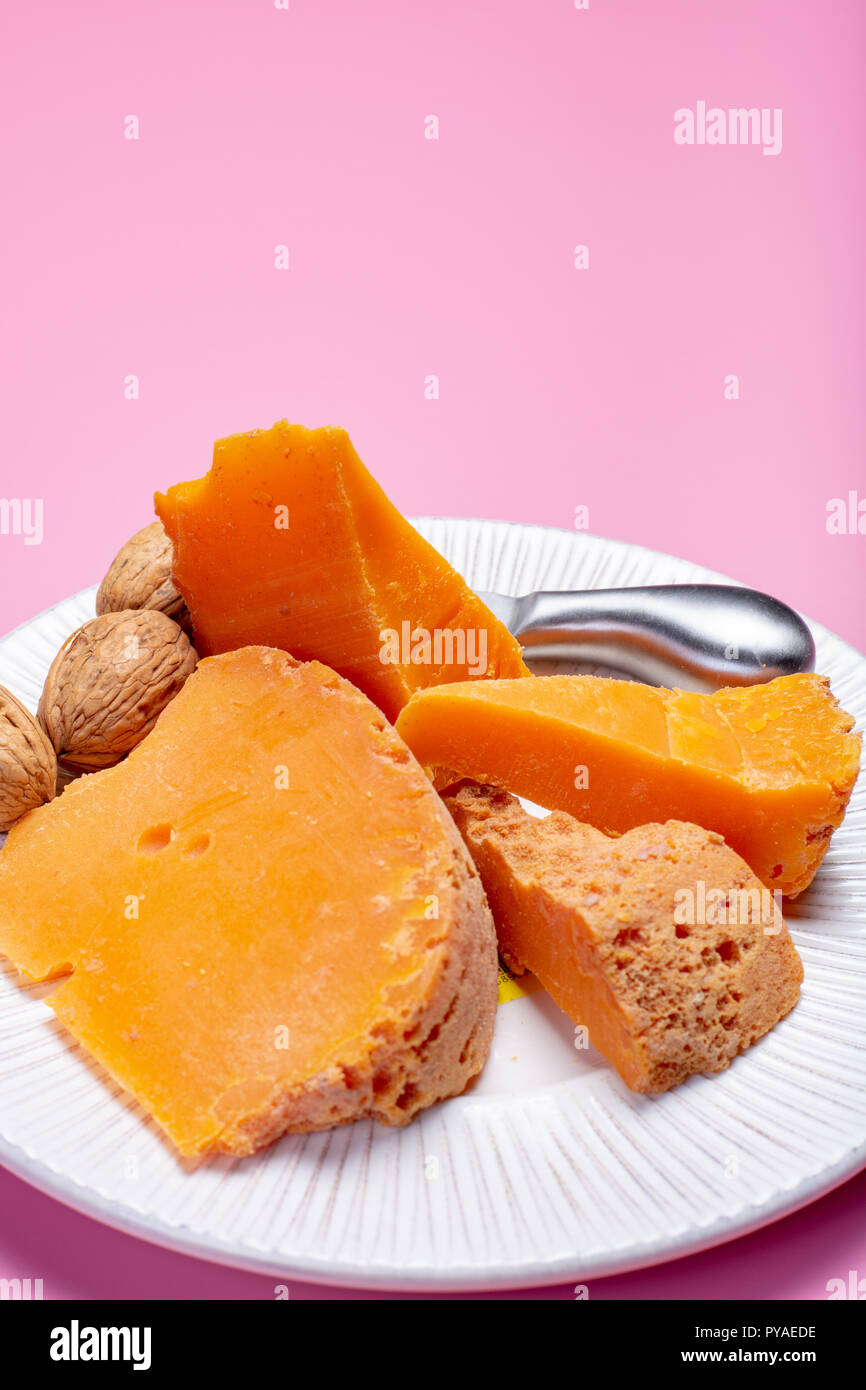 Pieces of native French aged cheese Mimolette, produced in Lille with ...