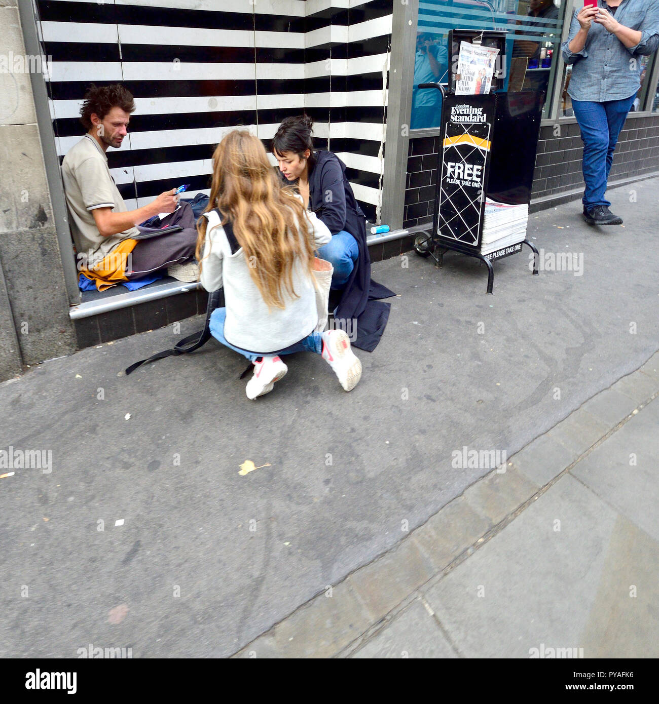 Person Helping Homeless