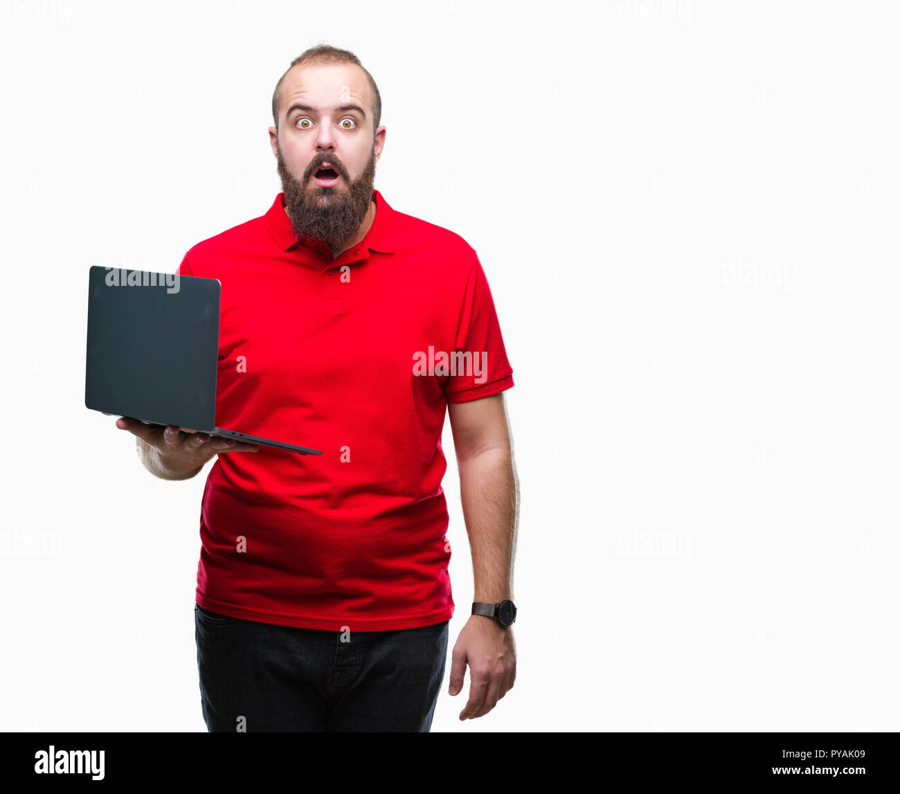 Young caucasian man using computer laptop over isolated background ...