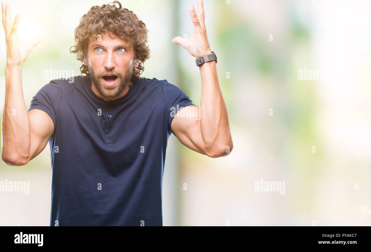 Handsome hispanic model man over isolated background celebrating crazy ...