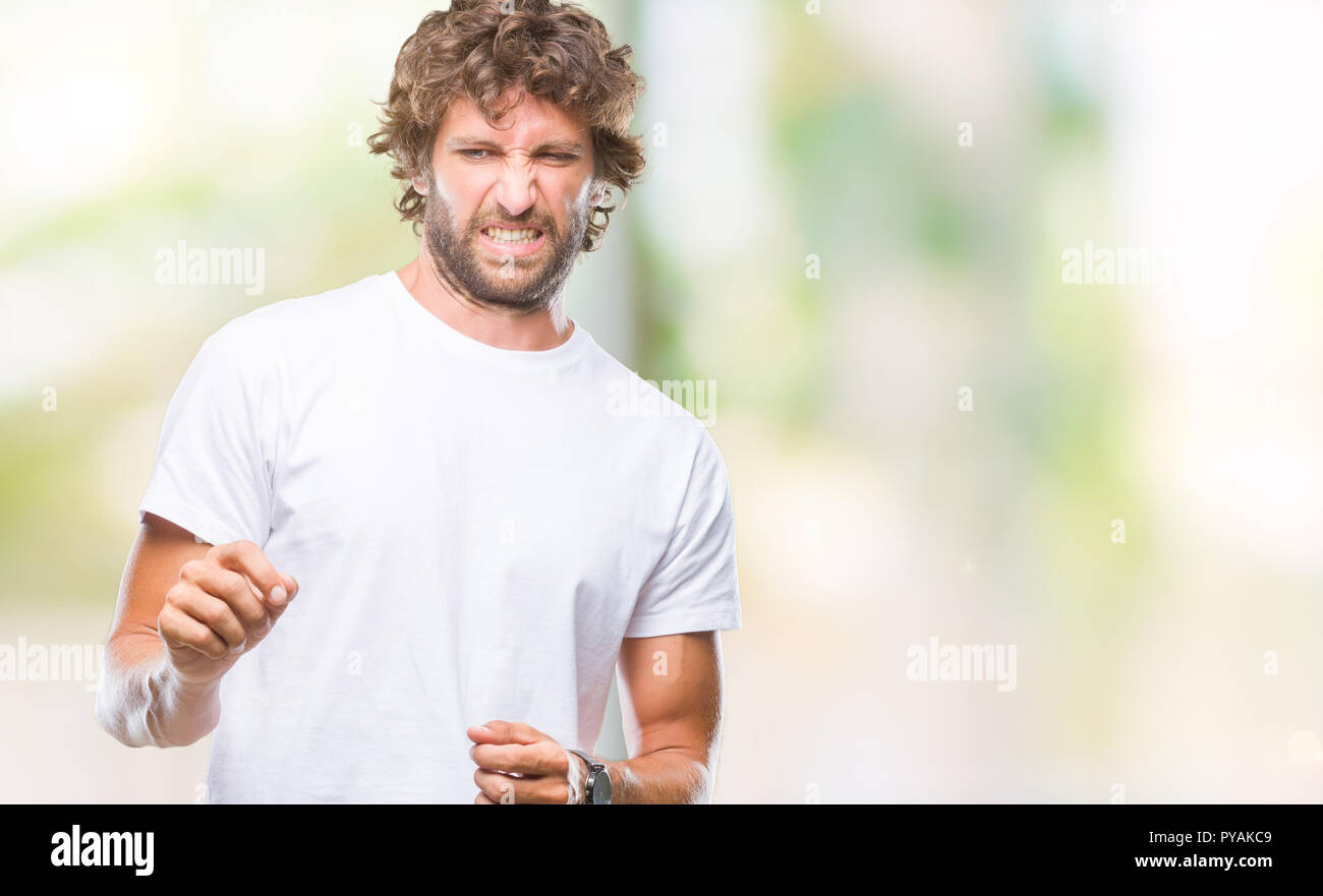 Handsome hispanic model man over isolated background disgusted ...