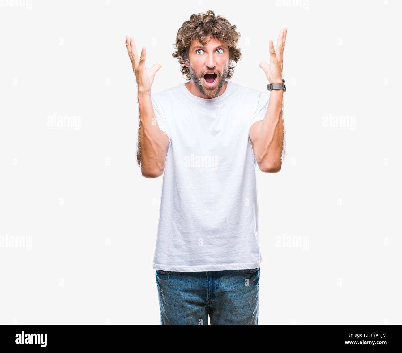 Handsome hispanic model man over isolated background celebrating crazy ...