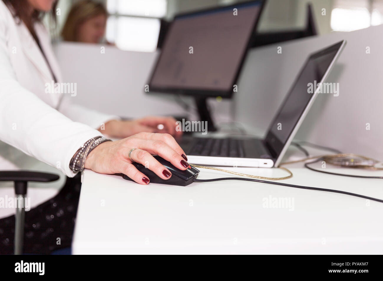 Business woman working on computer in office Stock Photo - Alamy