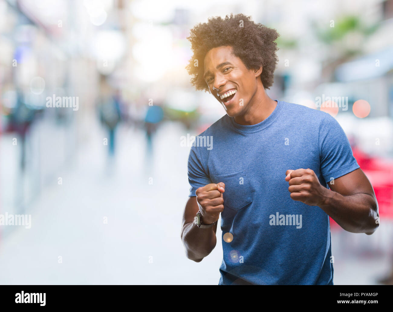 Afro american man over isolated background very happy and excited doing ...