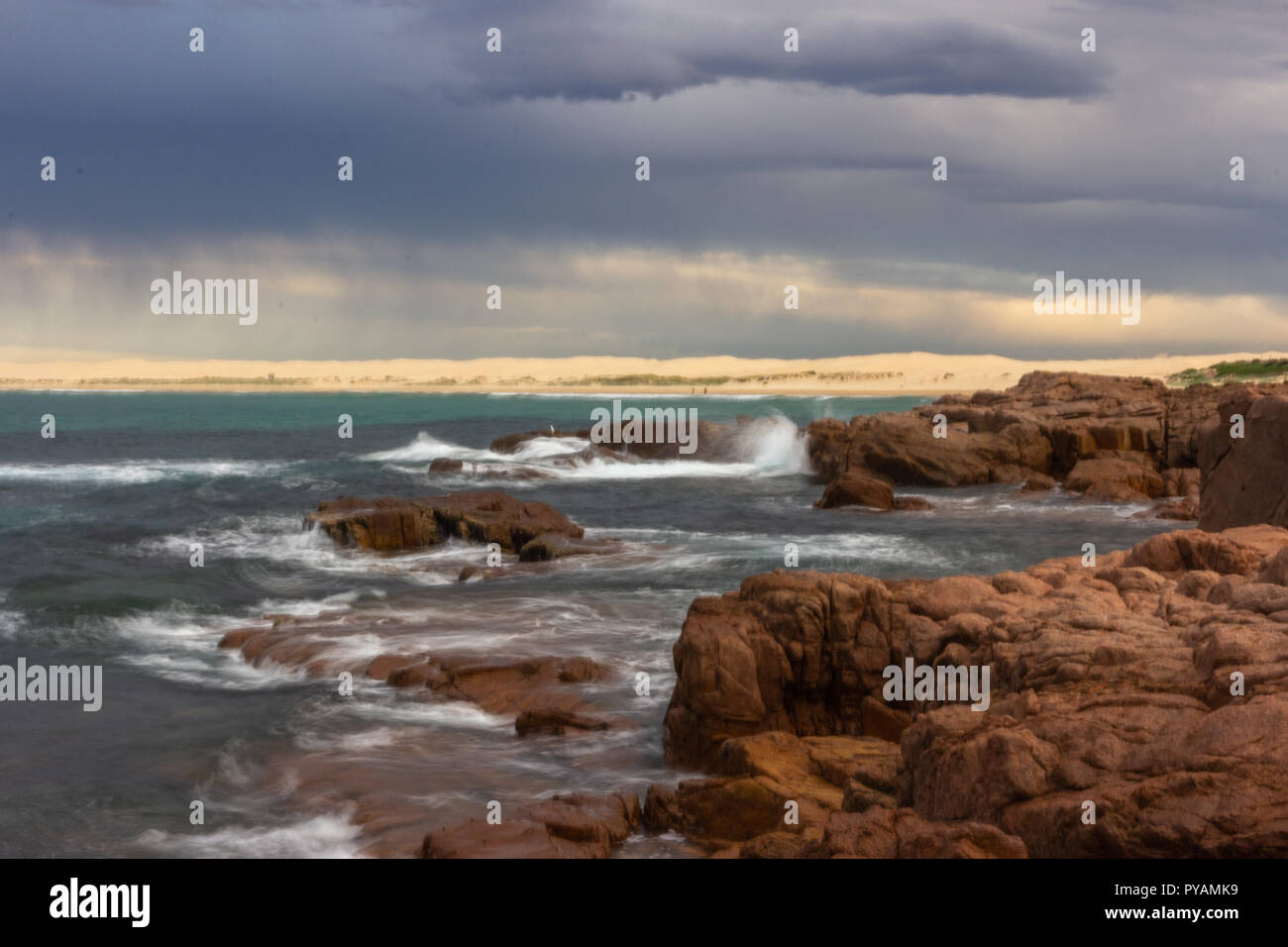 seascape Anna Bay beach in morning with sunrise sky and dramatic strom ...