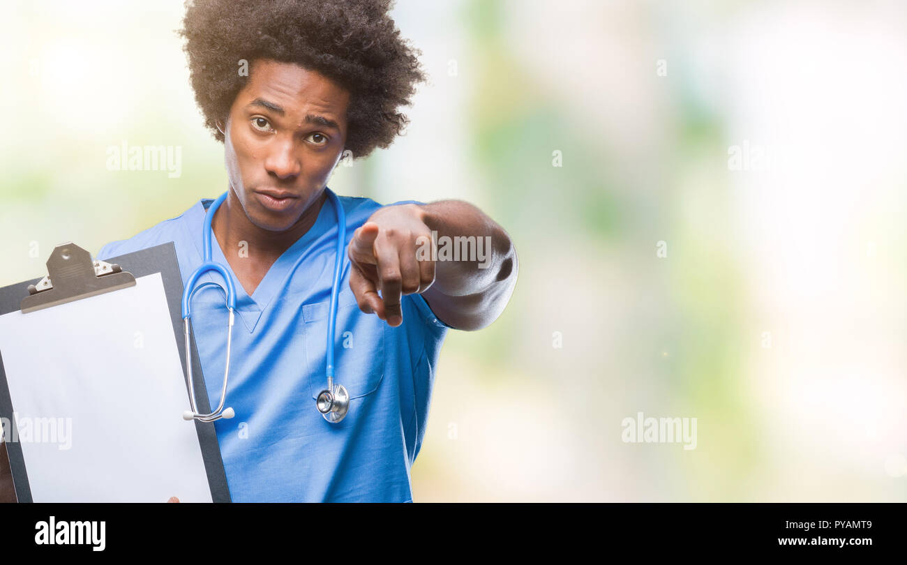 Afro american surgeon doctor holding clipboard man over isolated ...