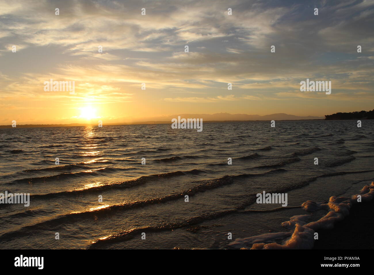 Sunset at Sandy Point Stock Photo - Alamy