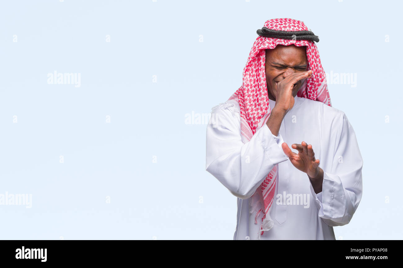 Young arabic african man wearing traditional keffiyeh over isolated ...