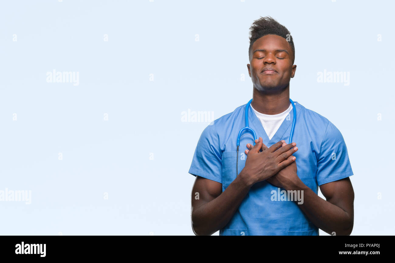 Young african american doctor man over isolated background wearing ...