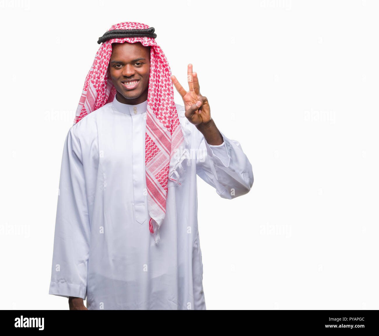 Young arabic african man wearing traditional keffiyeh over isolated ...