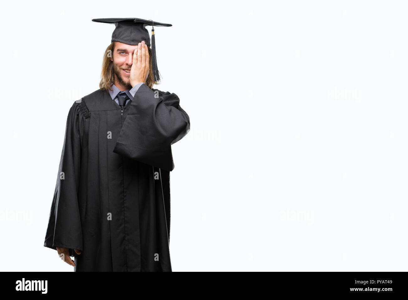 Young handsome graduated man with long hair over isolated background ...