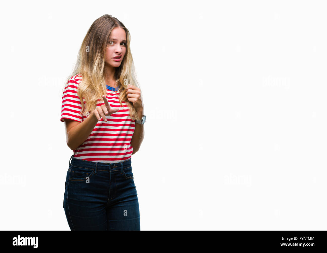 Young beautiful blonde woman over isolated background disgusted ...