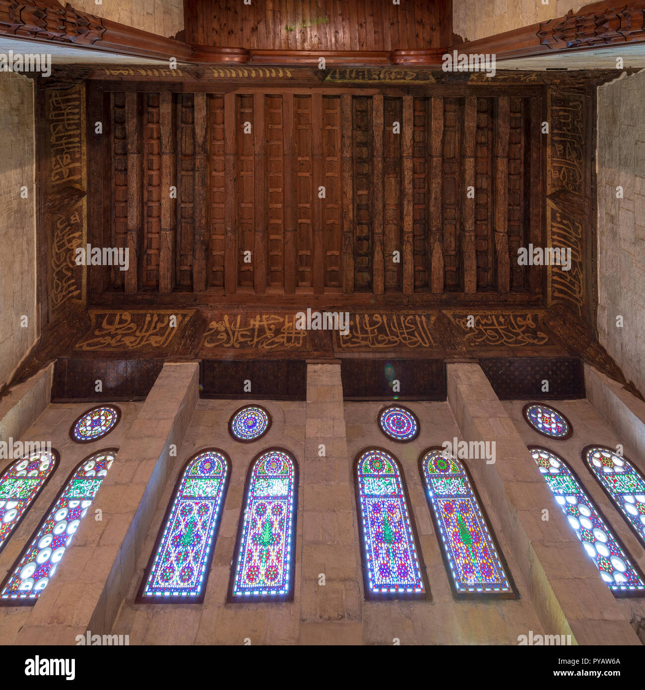 Wooden ornate ceiling with floral pattern decorations and colorful ...
