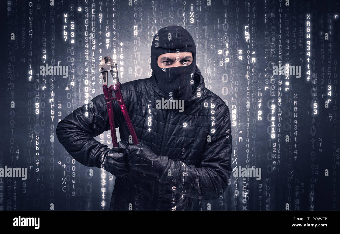 Burglar in action with encoded concept and his tools in his hand Stock ...