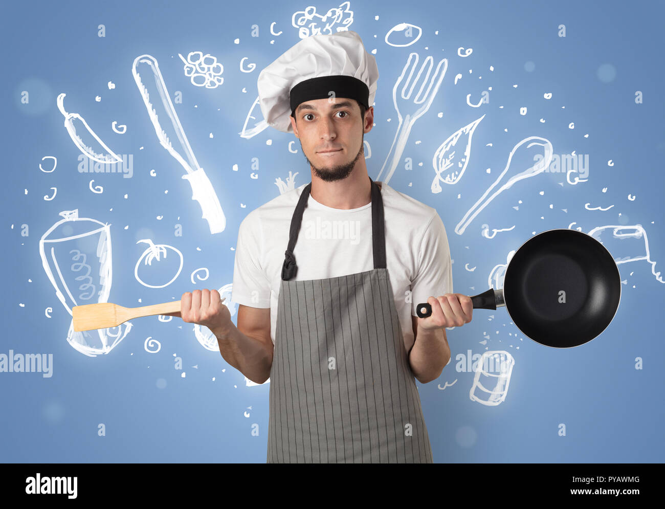 Young cook with kitchen instruments and drawn recipe concept on ...