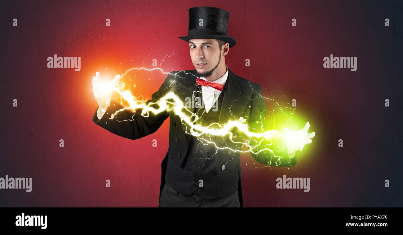Magician sparkling super power between his two hands Stock Photo - Alamy