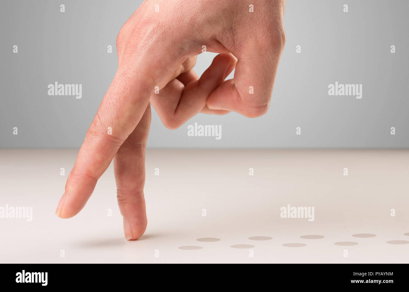 Female fingers walking with dots behind them Stock Photo - Alamy