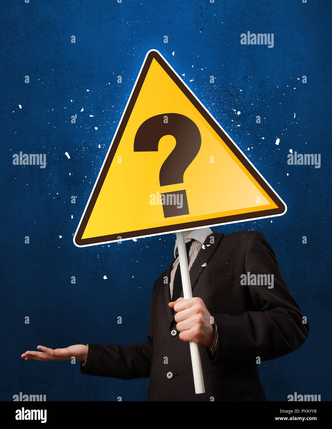 Smart businessman holding yellow sign with question mark Stock Photo ...