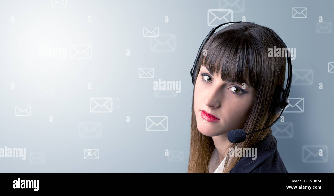 Young female telemarketer with white envelopes surrounding her Stock ...