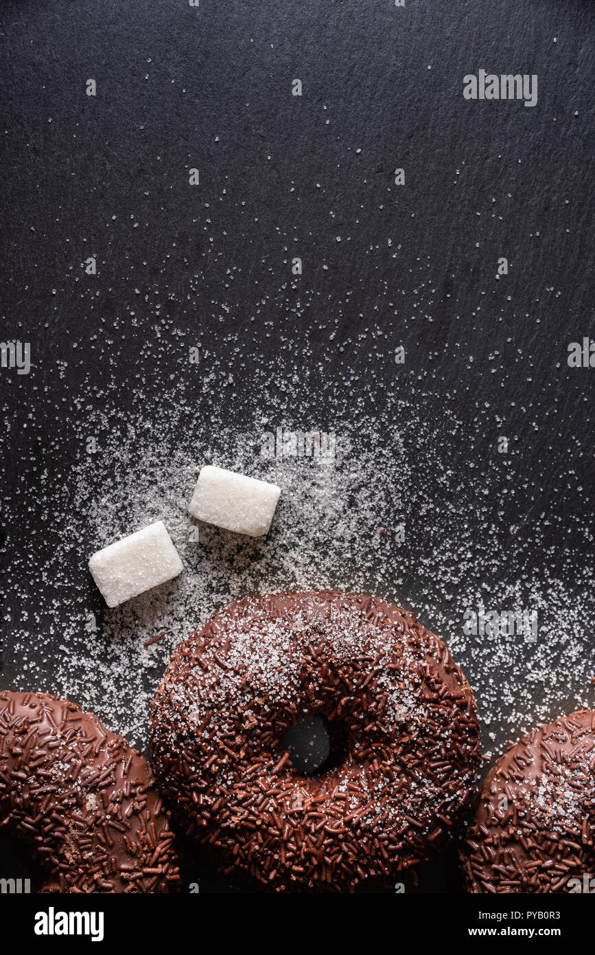 Chocolate doughnuts with sugar cubes Stock Photo - Alamy