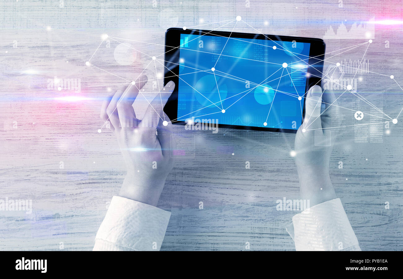 Hand using tablet with linking graphs charts report and informational ...
