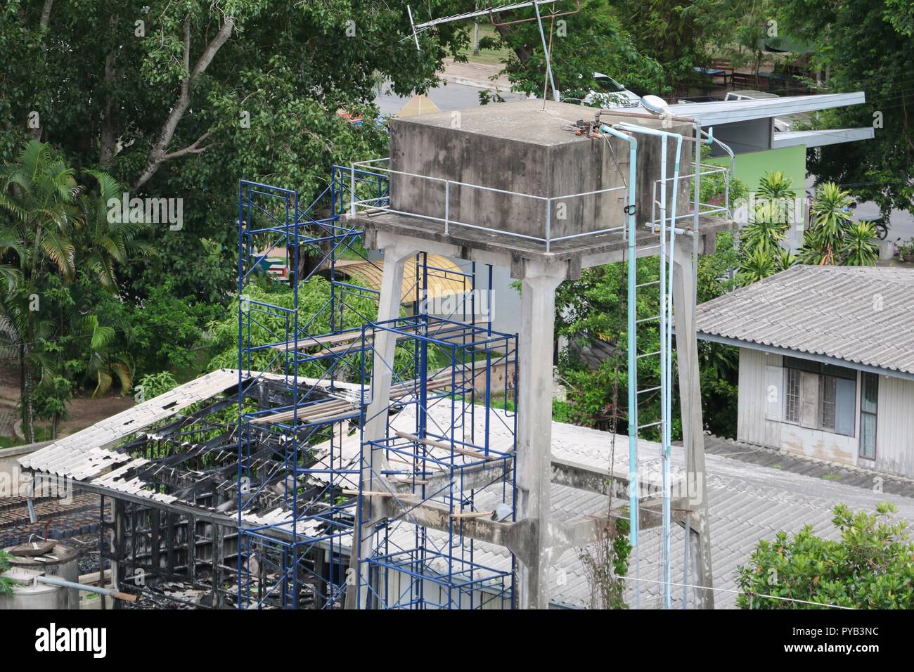 Water tank and scaffolding in repair for agriculture with blue sky ...