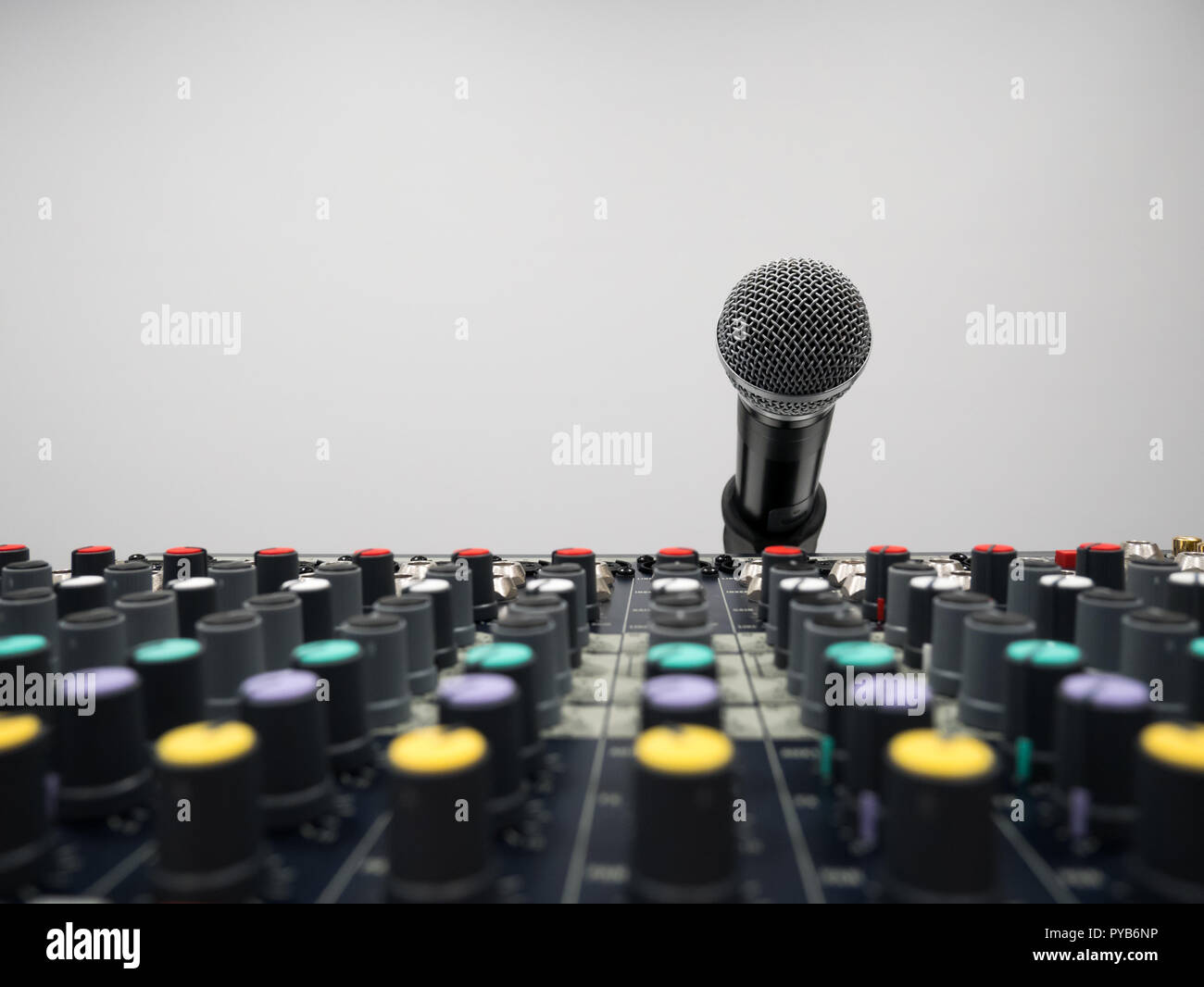 Audio mixer console in studio with microphone at background Stock Photo ...