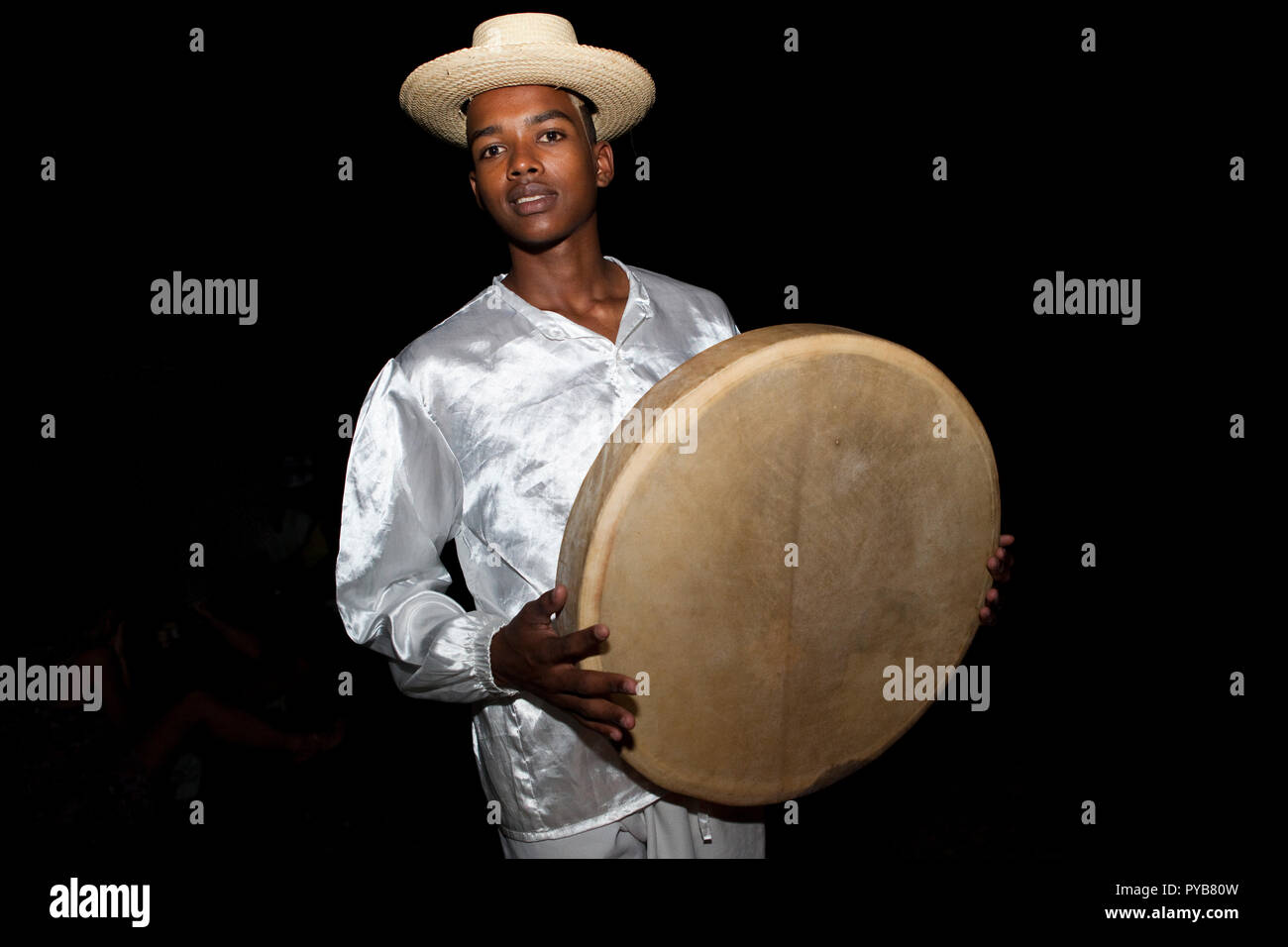 Sega drummer on the beach at a Sware Tipik performance during the 2013 ...