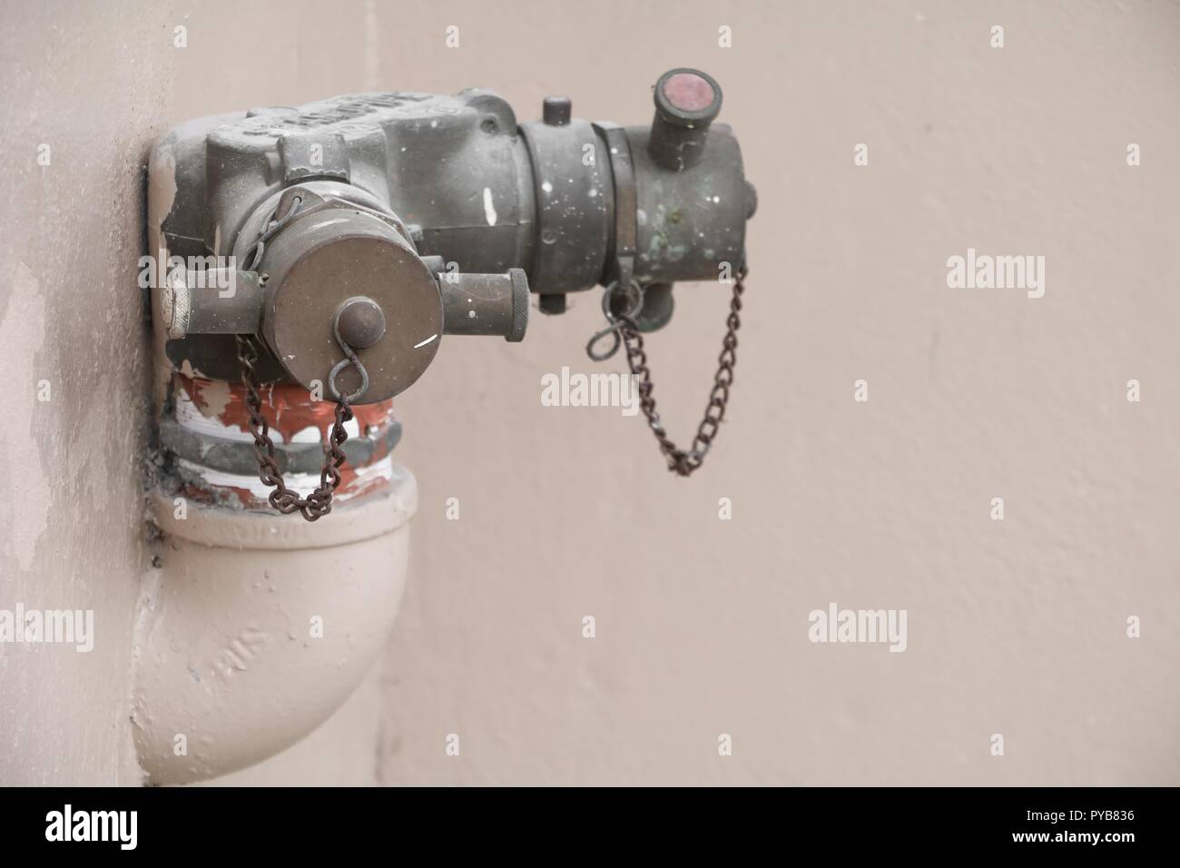sluice plumbing fire hydrant in wall with copy space for add text Stock ...