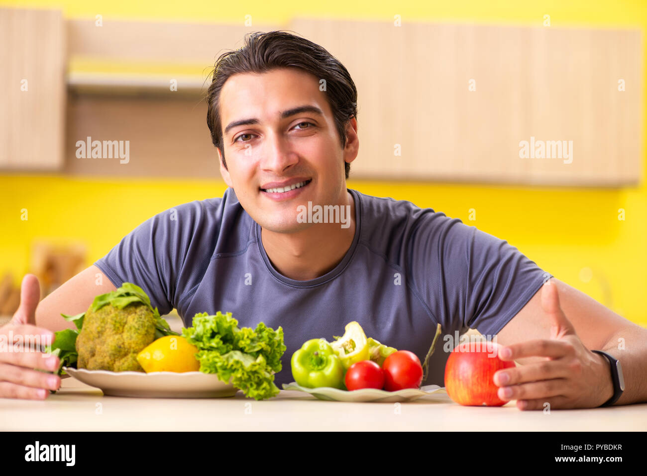 Young man in dieting and healthy eating concept Stock Photo - Alamy